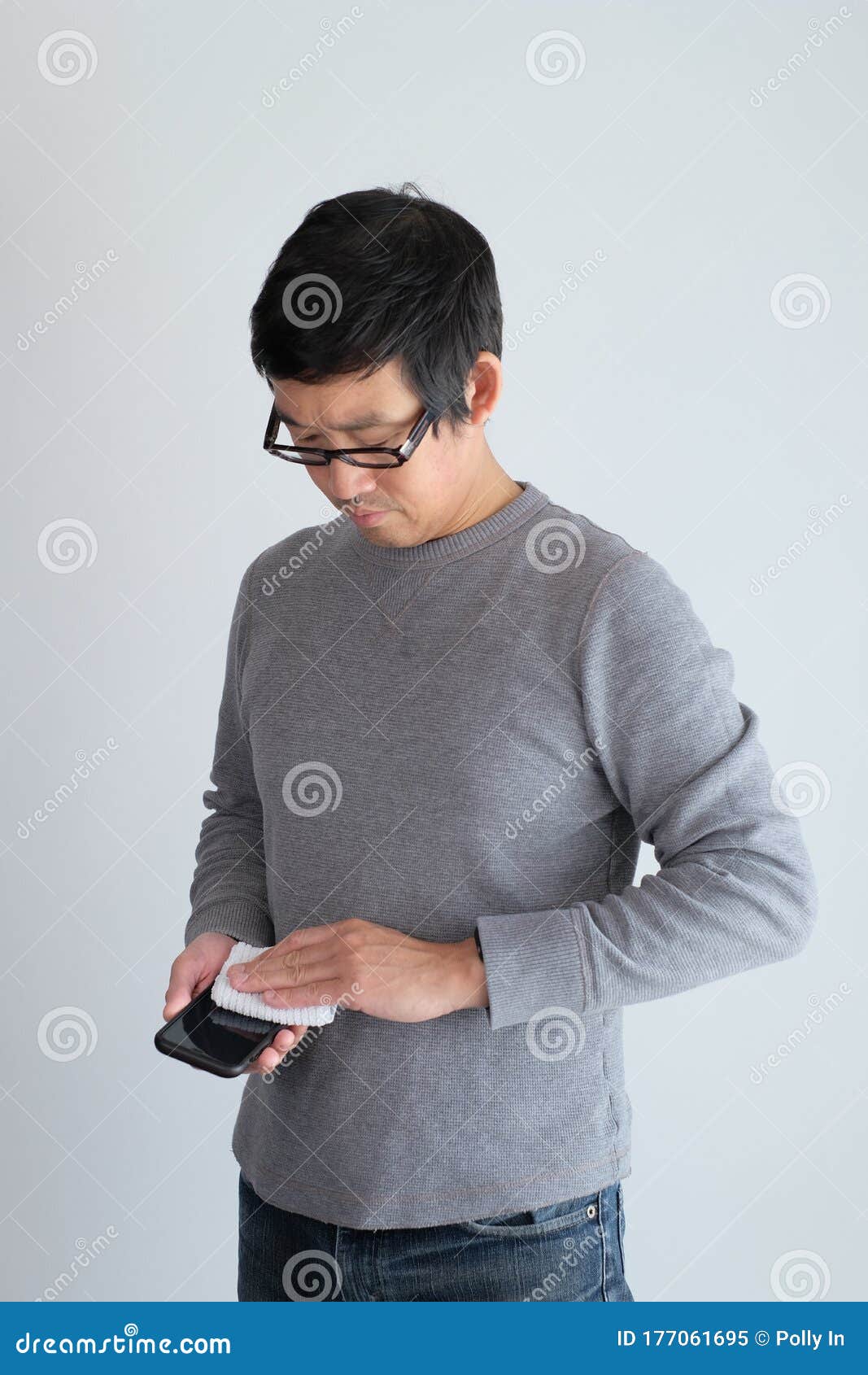 Man Cleaning the Phone Surface To Kill and Prevent Corona Virus Stock ...