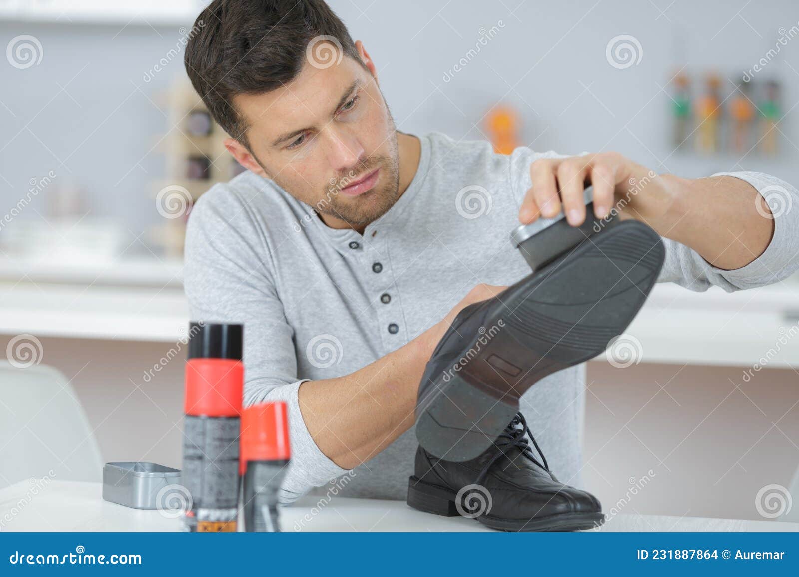 Man cleaning shoes stock photo. Image of polishing, footwear - 231887864