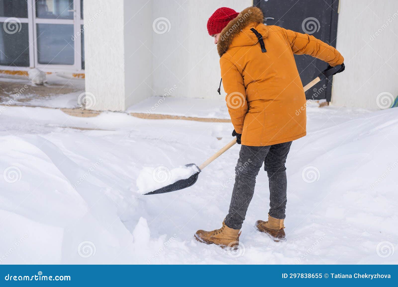 Man Cleaning Snow from Sidewalk and Using Snow Shovel. Winter Season ... Man Cleaning Snow from Sidewalk and Using Snow Shovel. Winter Season ...