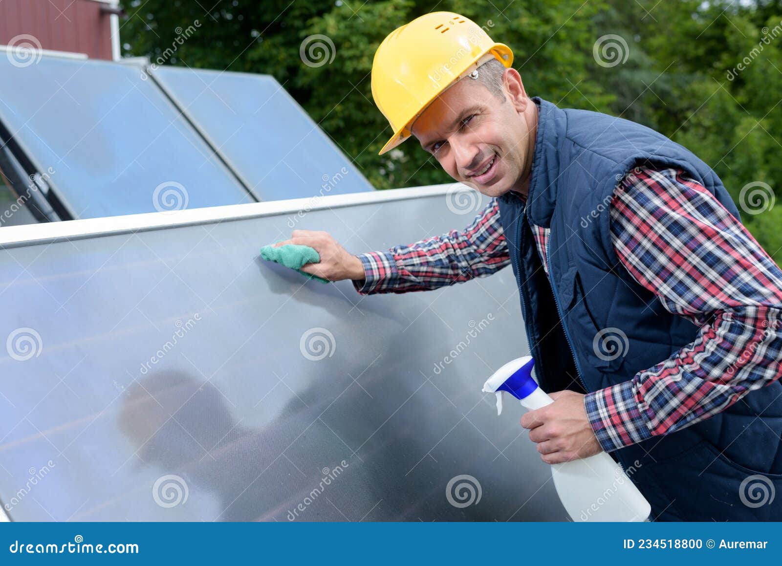 Man cleaning solar panels stock photo. Image of maintenance - 234518800