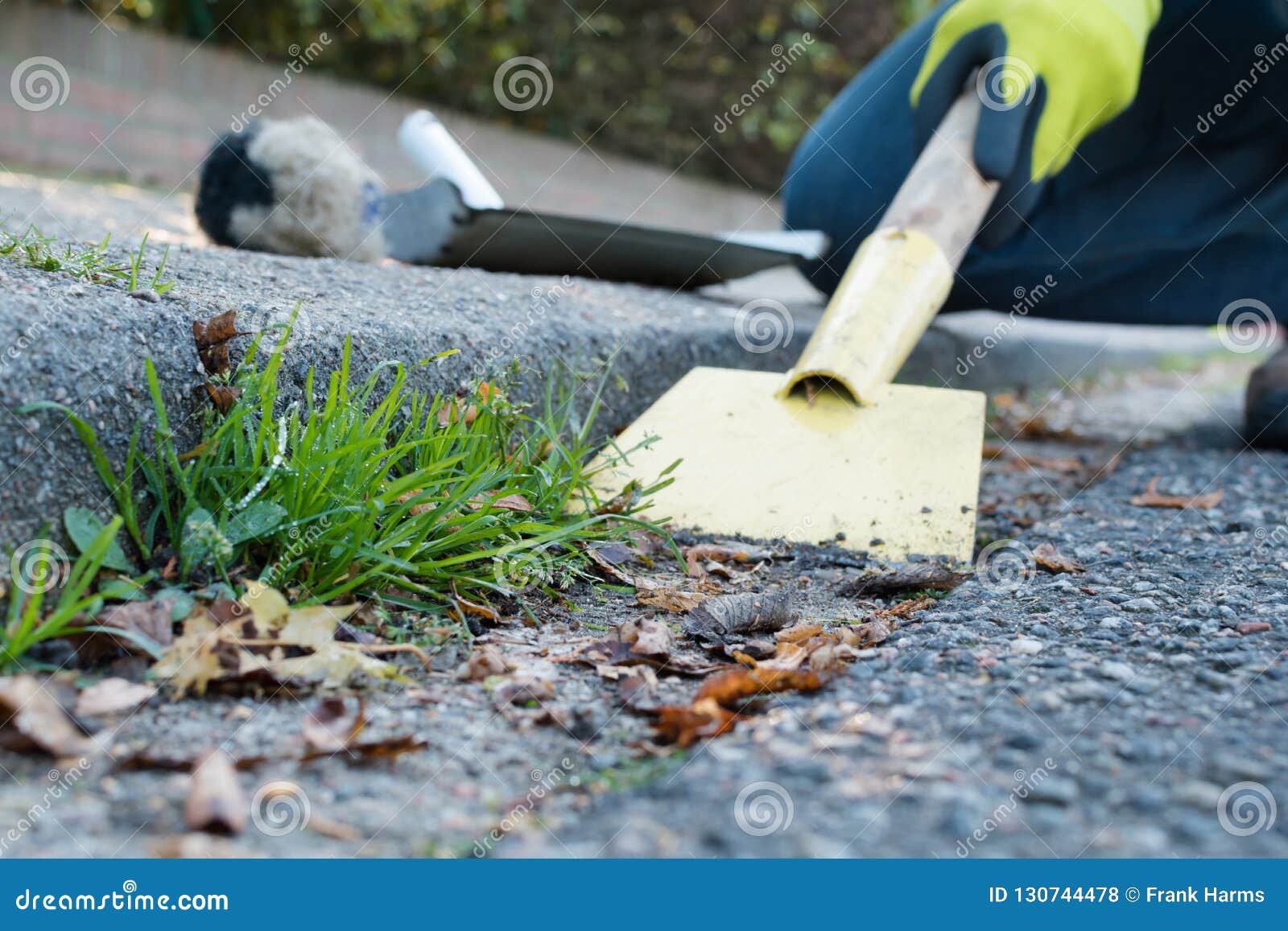 Man is cleaning the gutter stock photo. Image of brown - 130744478
