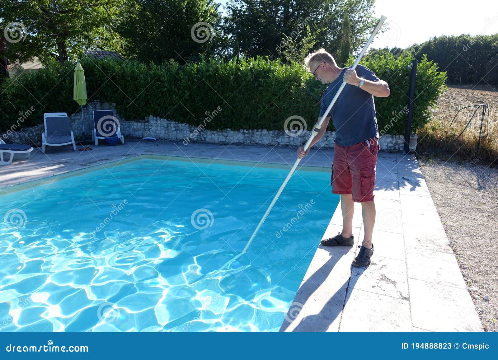 Man Cleaning a Swimming Pool Stock Image - Image of pole, male: 194888823