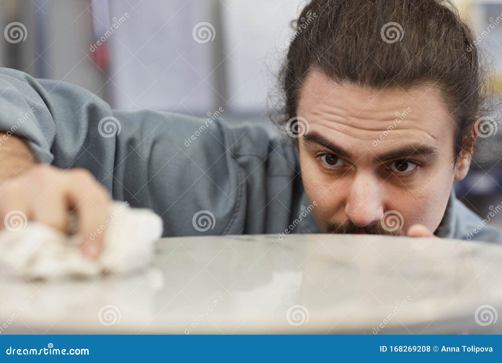 Man cleaning the table stock photo. Image of business - 168269208