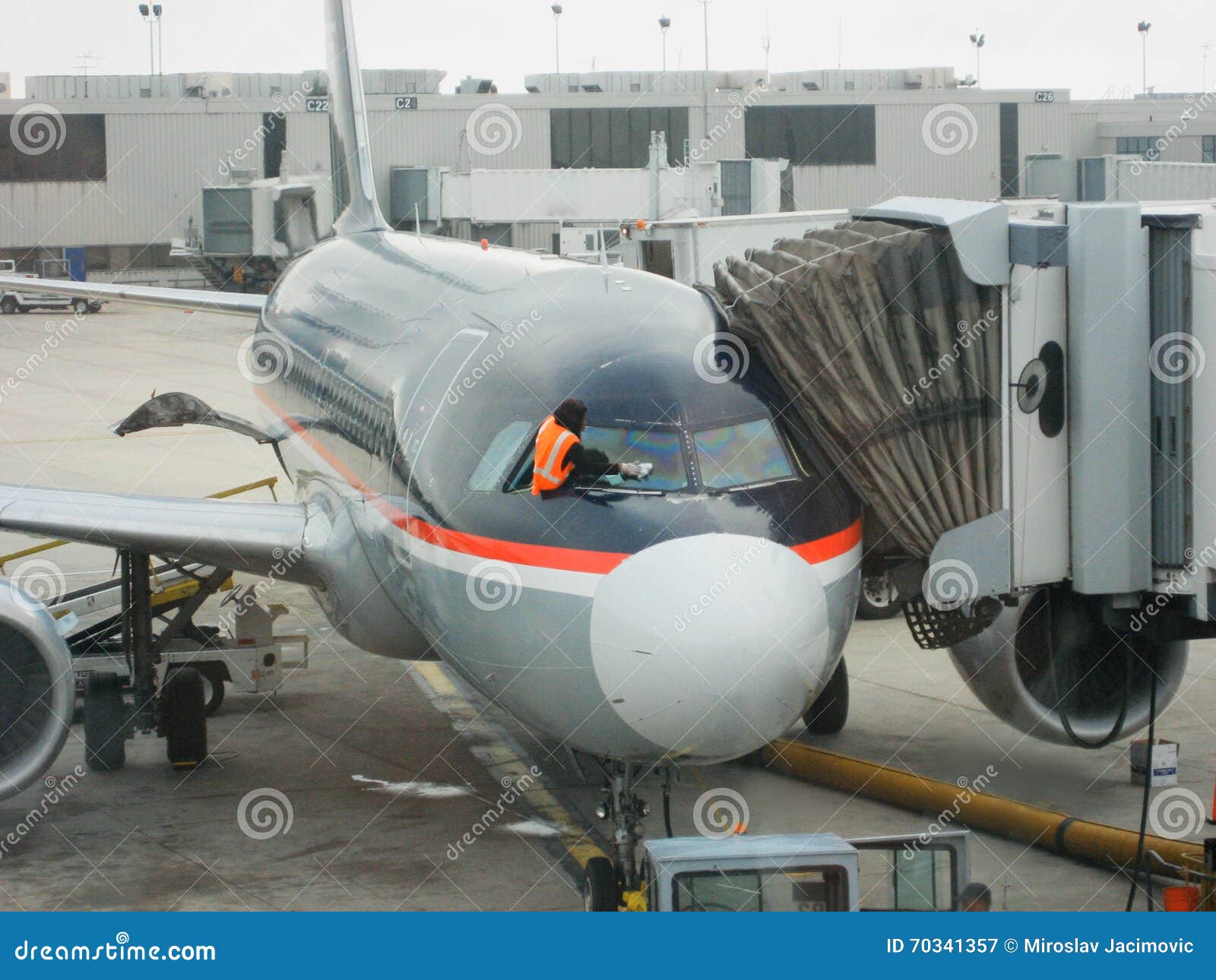 Man Cleaning the Window on Jet Airplane Stock Image - Image of airline ...