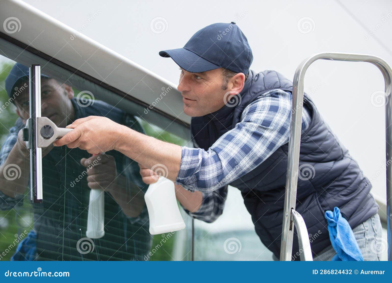 Man Cleaning Window in Office Stock Photo - Image of emotional ...
