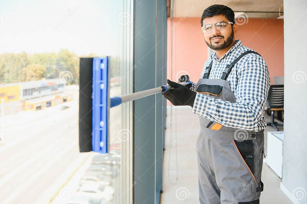 A Man Cleaning Windows. Men Washes the Windows Stock Photo - Image of ...