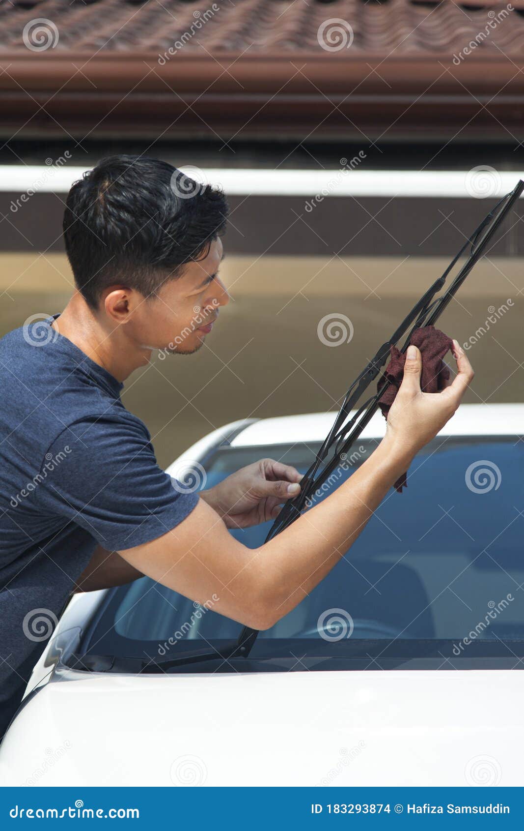 Man Cleaning Windshield Wiper of His Car Stock Photo - Image of ...