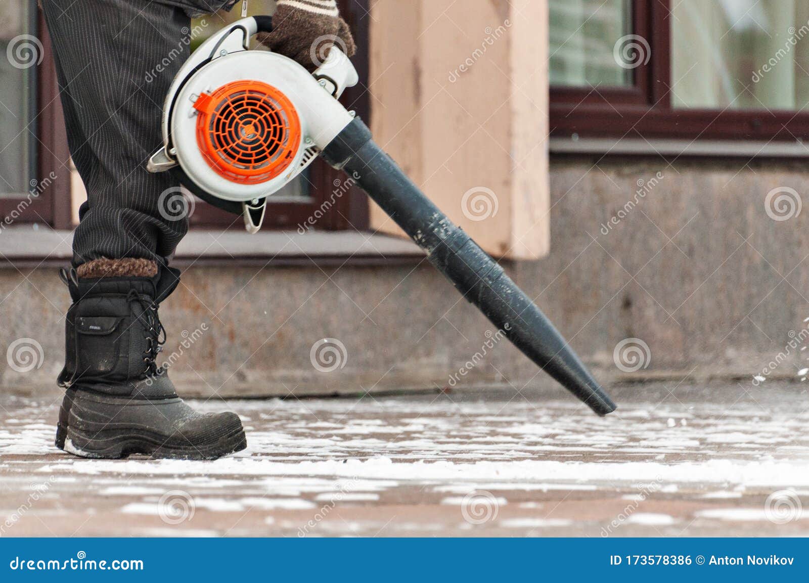 Man Cleans Street from Snow with Blower Stock Photo - Image of action ...