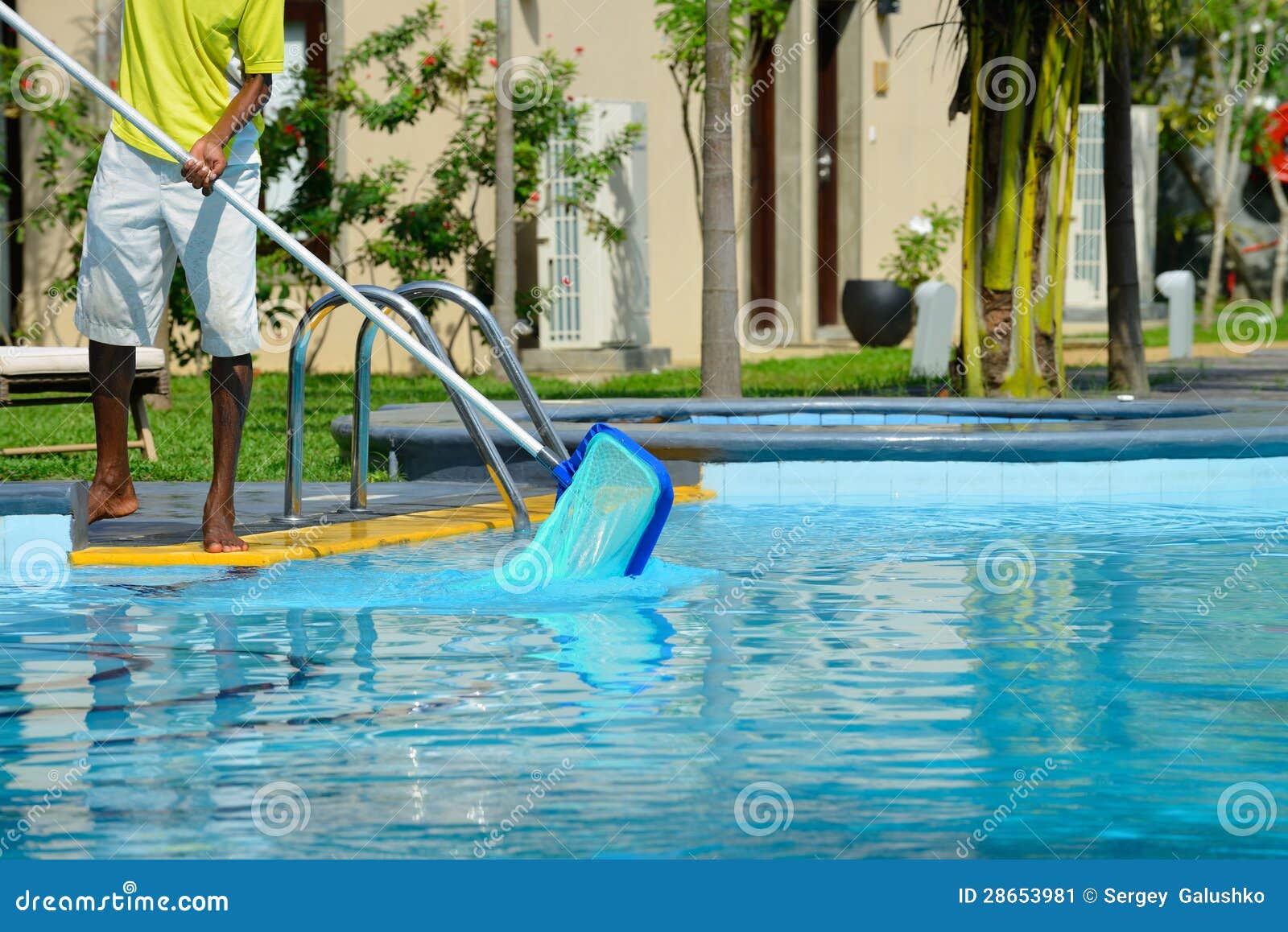 A man cleans the pool stock image. Image of care, blue - 28653981