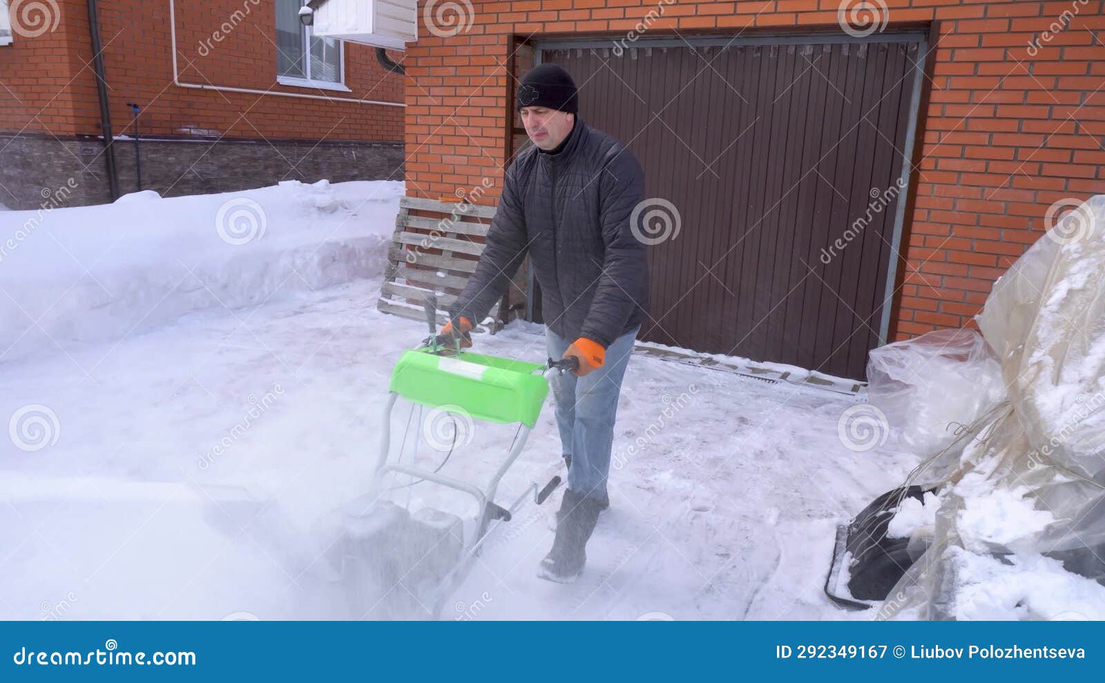 A Man Cleans Snow in the Winter in the Courtyard of the House. Man ...