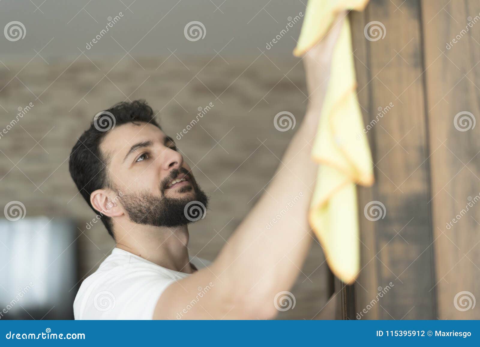 Man Cleans the Windows of the House with Multipurpose Glass Cleaner ...
