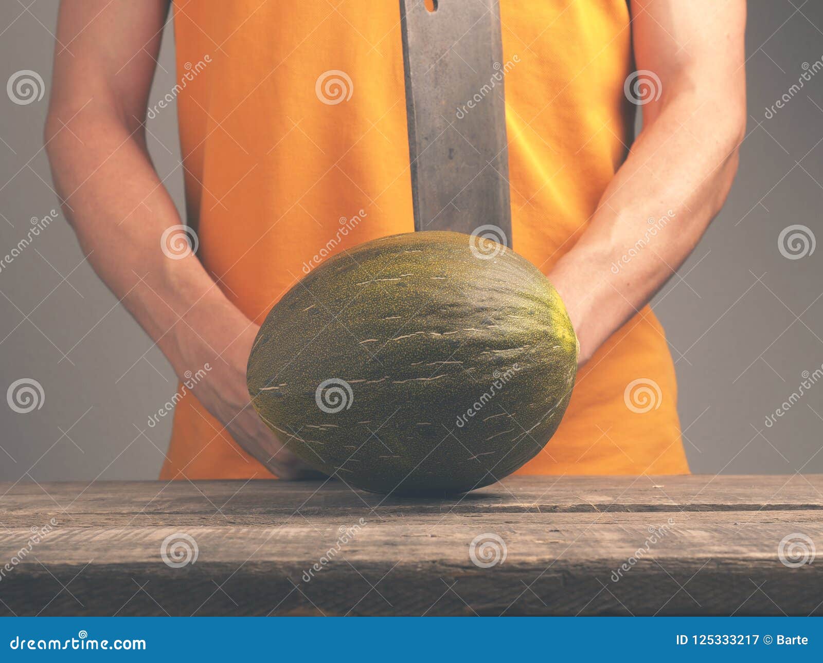 Man with a Cleaver and a Melon Stock Image - Image of juicy, natural ...