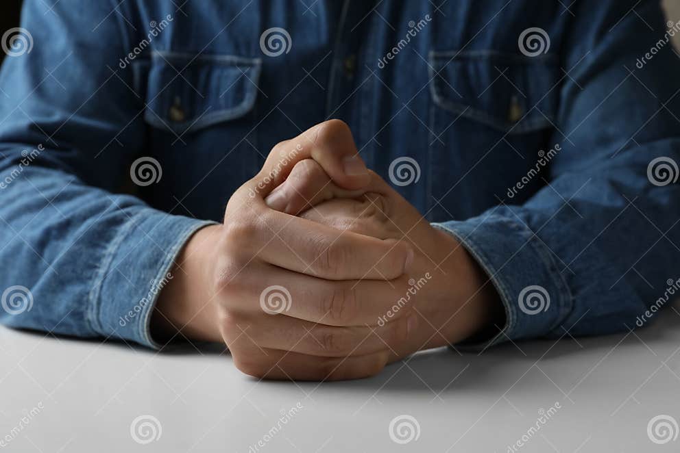 Man Clenching Hands at Table while Restraining Anger, Closeup Stock ...