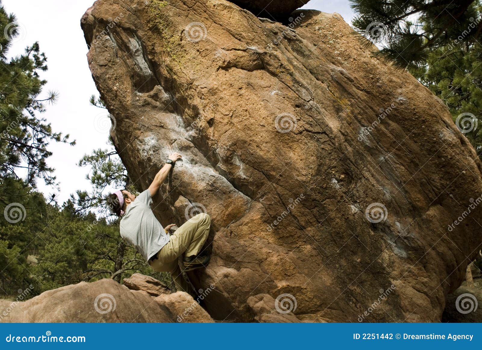 Man Climbing Boulder stock photo. Image of climber, ascending - 2251442