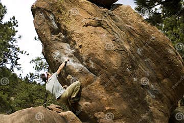 Man Climbing Boulder stock photo. Image of climber, ascending - 2251442