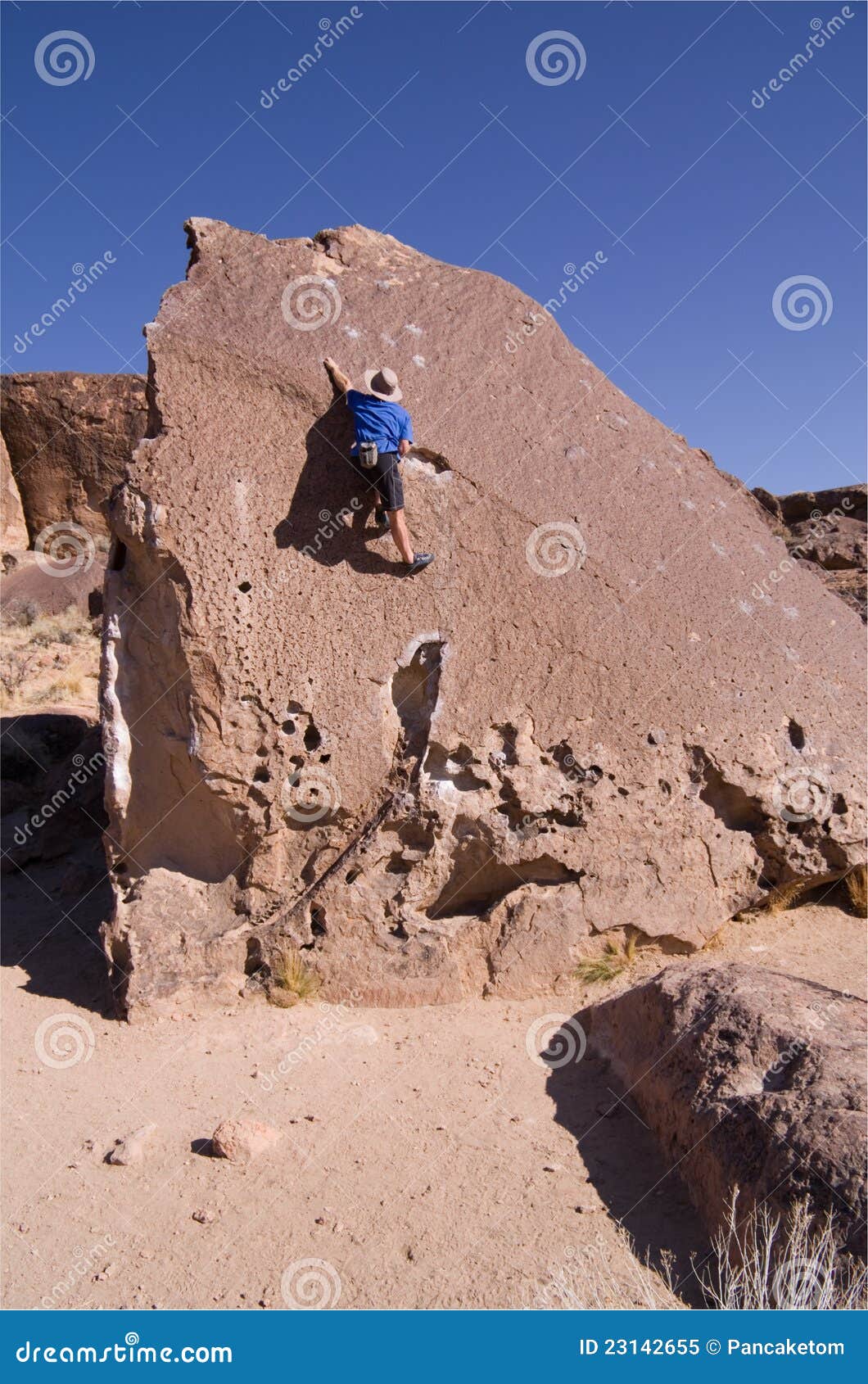 Man climbing boulder stock image. Image of bishop, sunny - 23142655