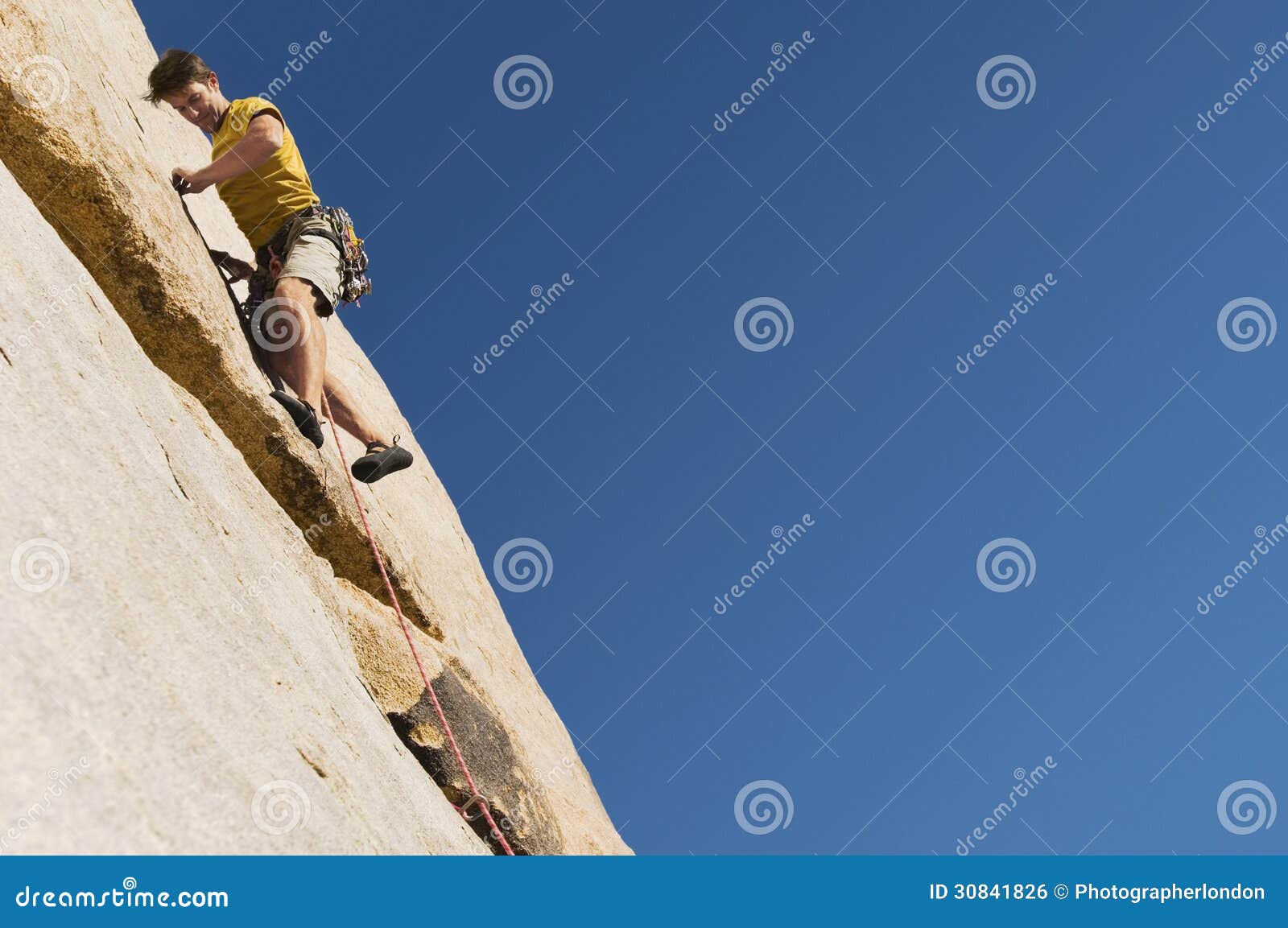 Man Climbing on Cliff stock photo. Image of freetime - 30841826