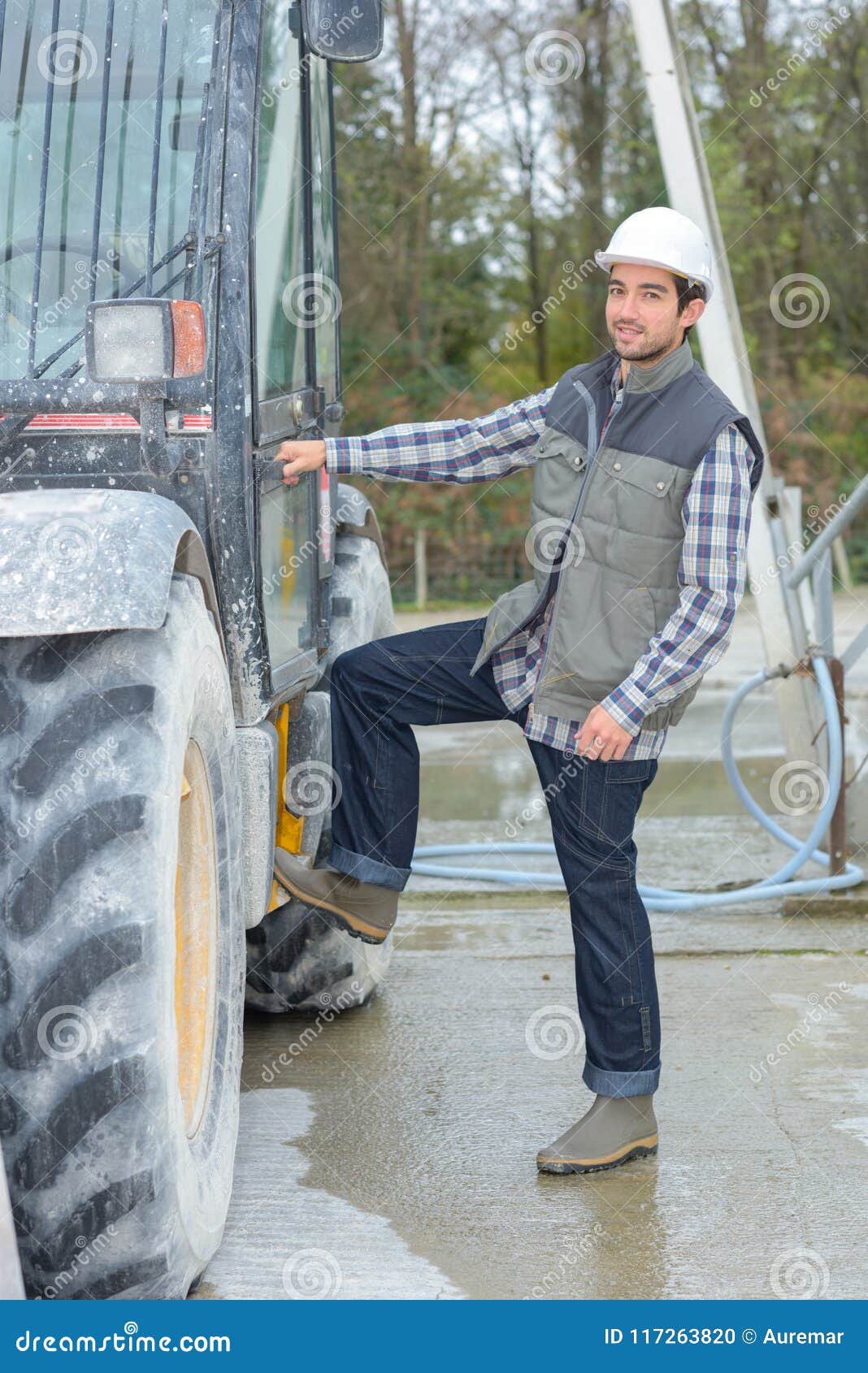 Man Climbing into Construction Vehicle Stock Photo - Image of outdoor ...