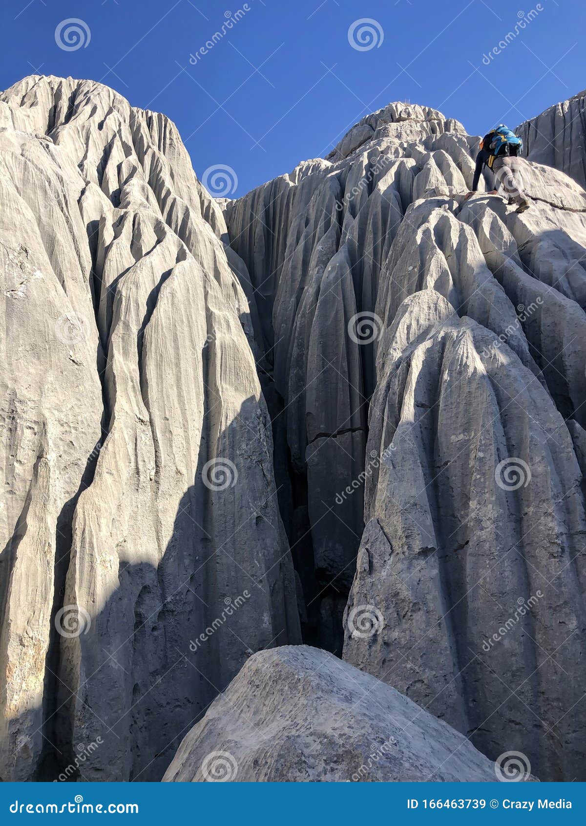 Man Climbing through Dangerous, Deadly and Sharp Lapy Cliffs Stock ...