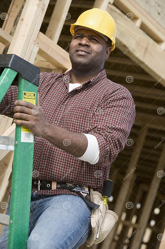 Man Climbing a Ladder at Construction Site Stock Image - Image of ...