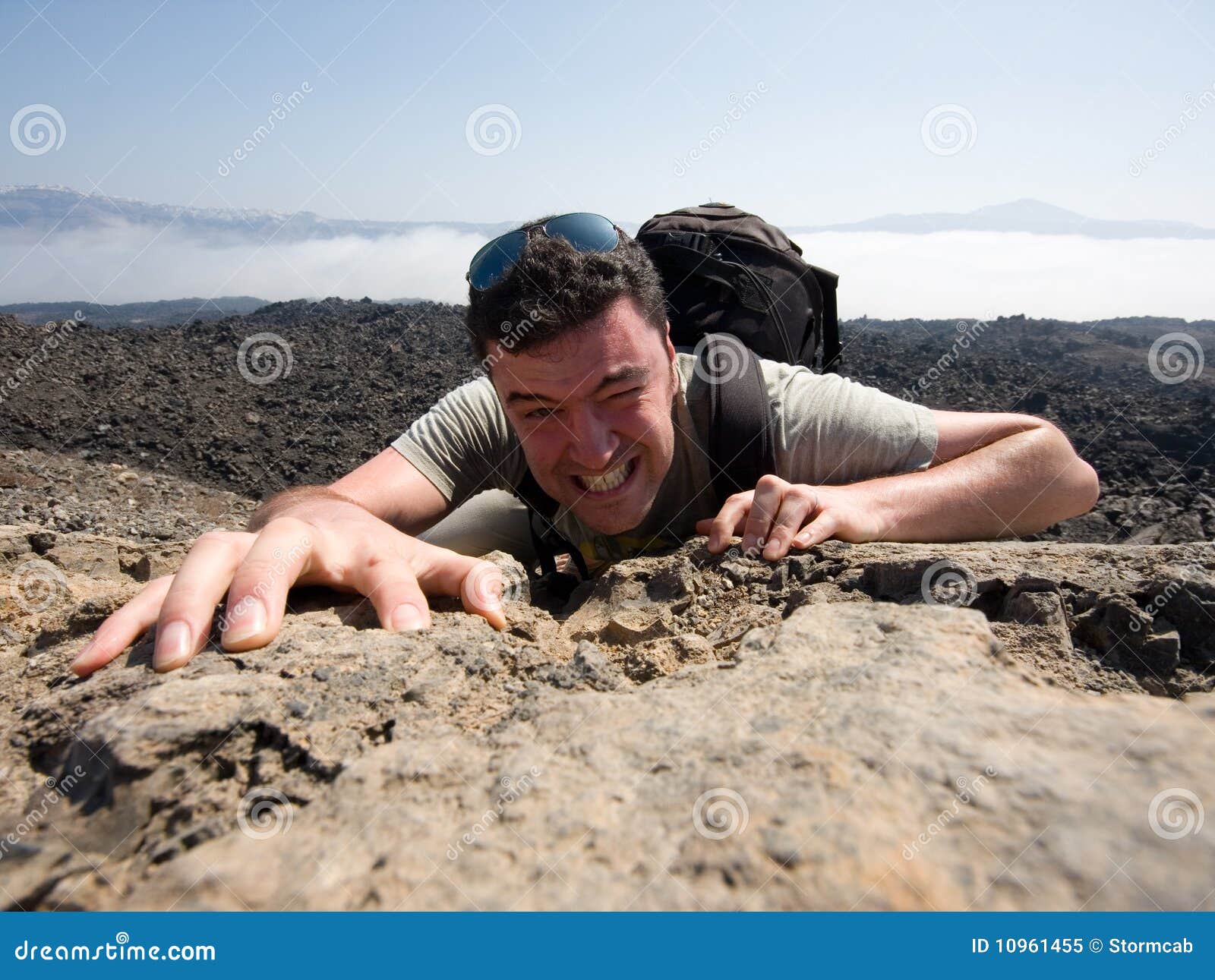Man climbing a mountain stock image. Image of adventure - 10961455