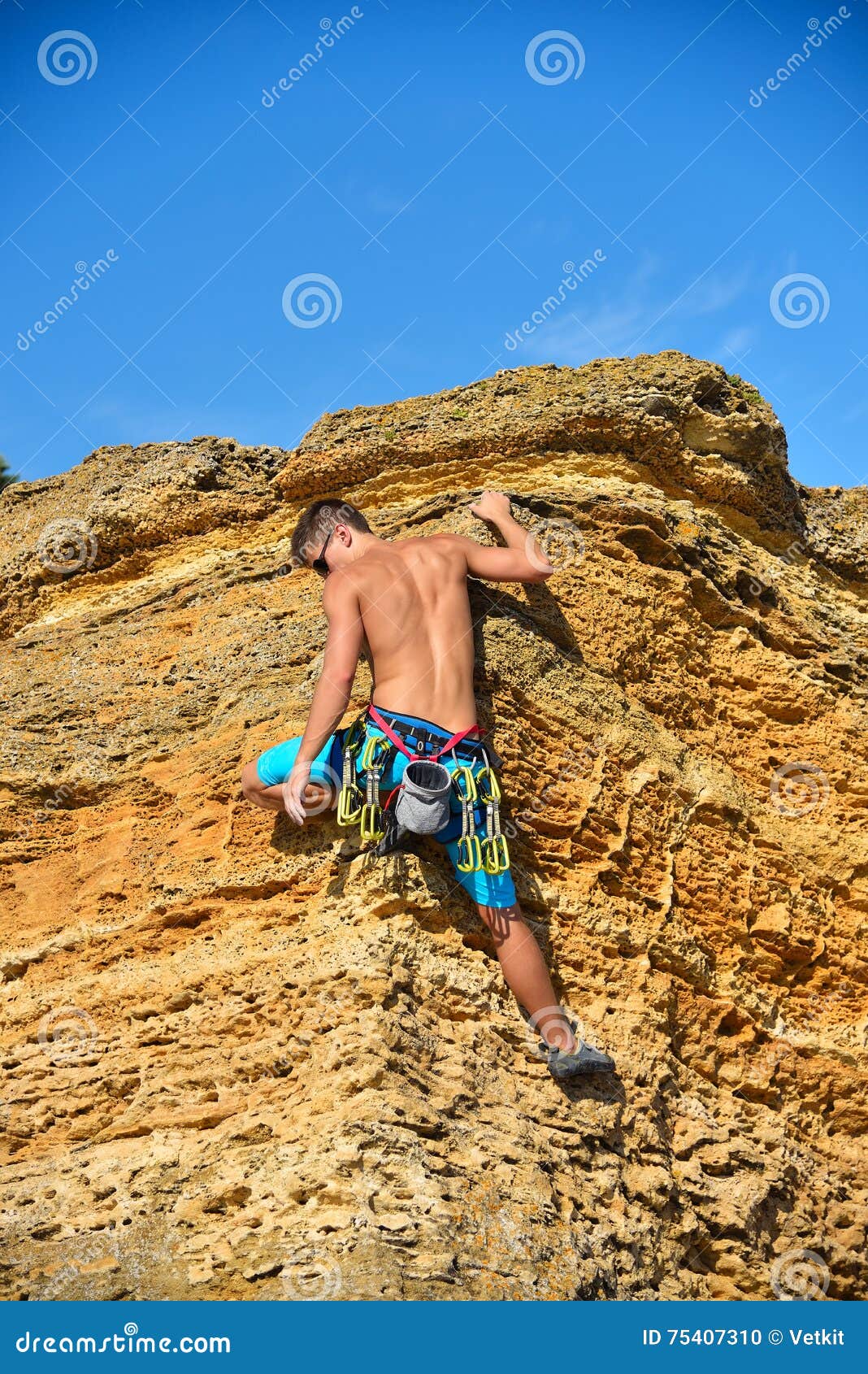 Man climbing on Mountain stock photo. Image of adrenaline - 75407310