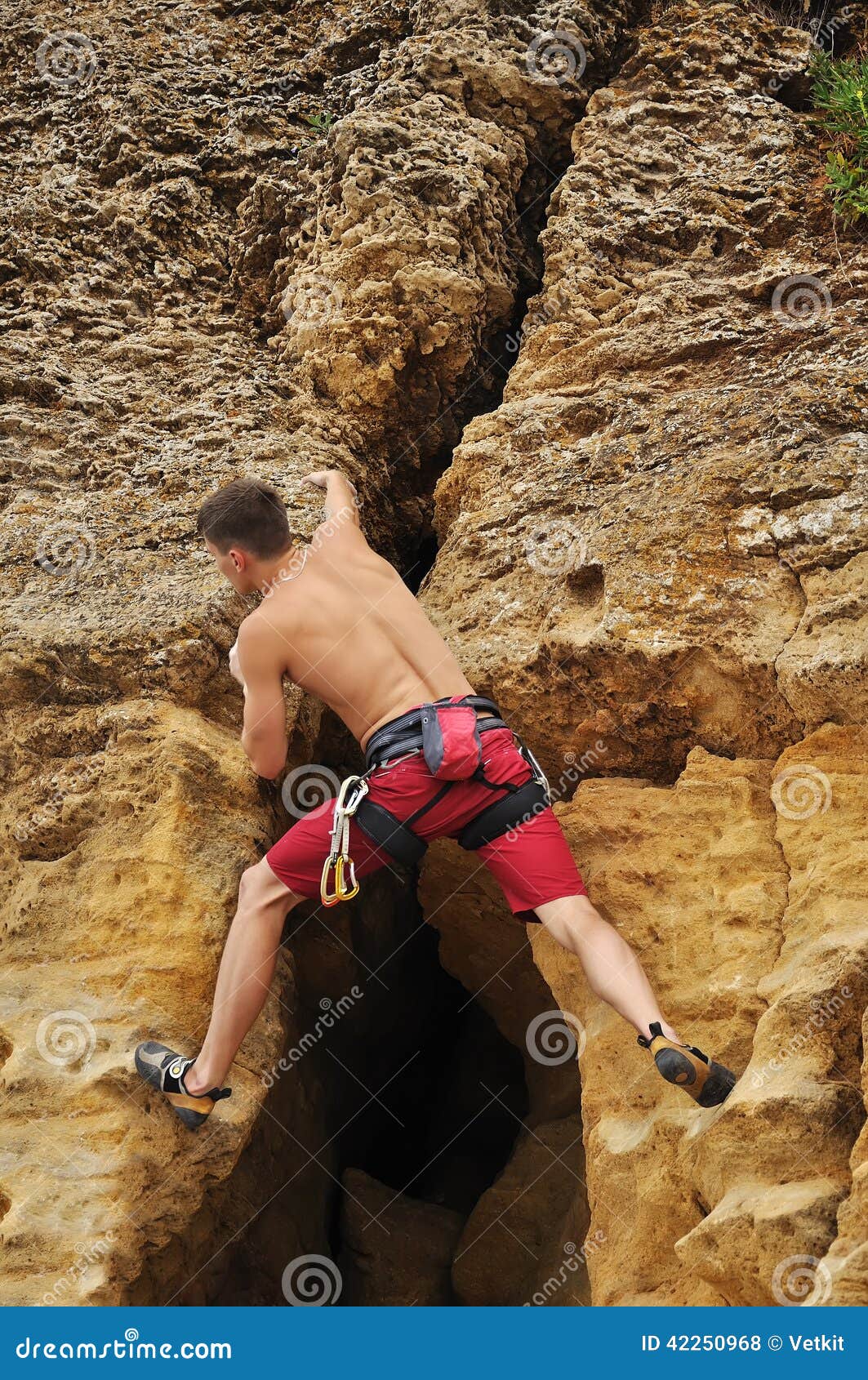 Man climbing on rock stock photo. Image of explore, male - 42250968