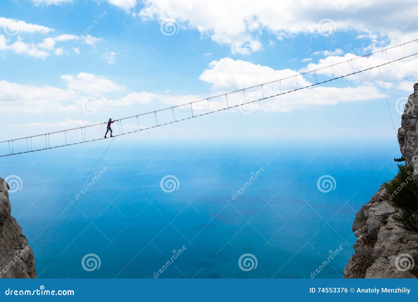 Man Climbing on the Suspension Bridge. Stock Photo - Image of crimea ...
