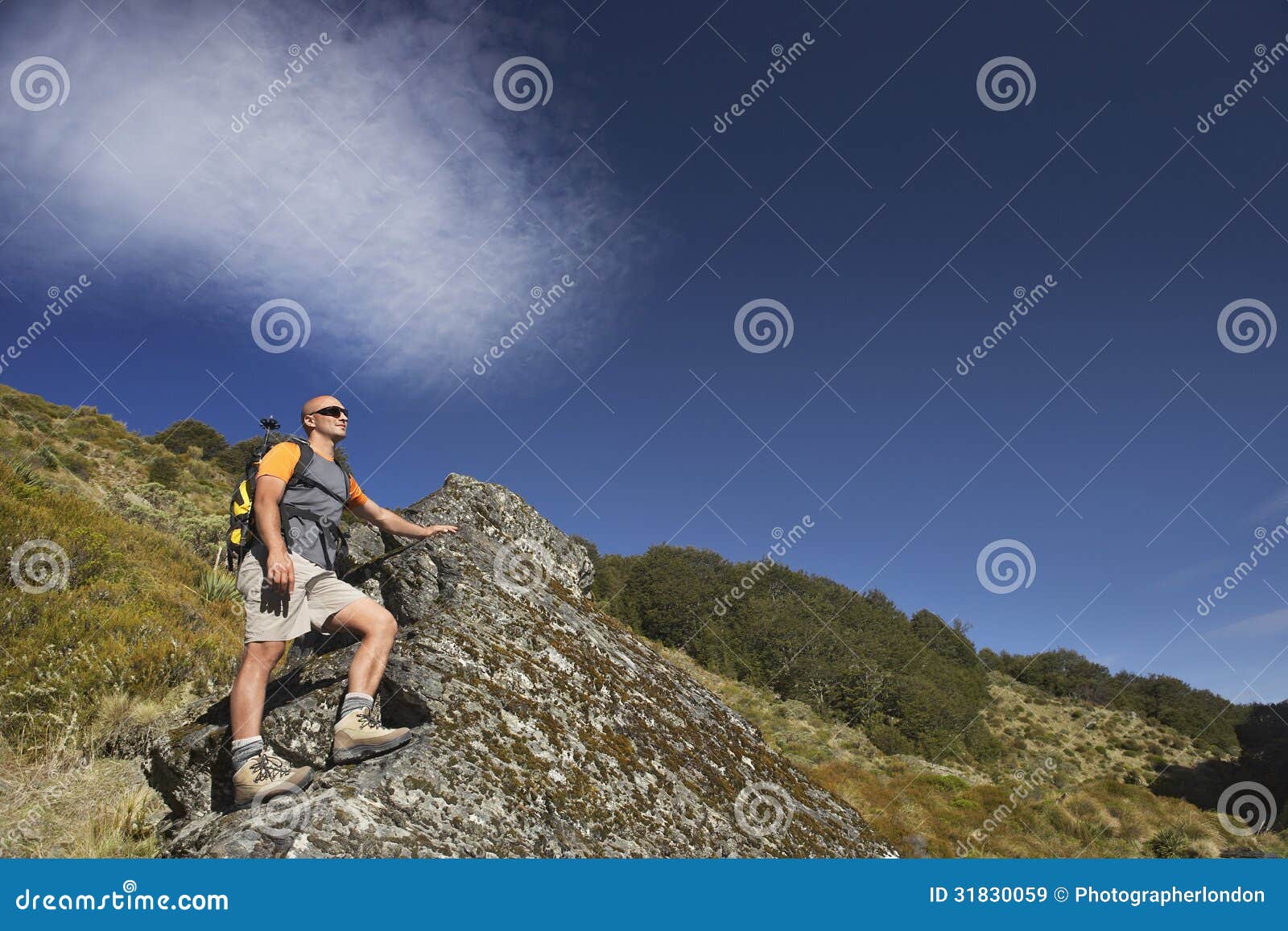 Man Climbing Up Boulder in Forest Valley Stock Image - Image of island ...
