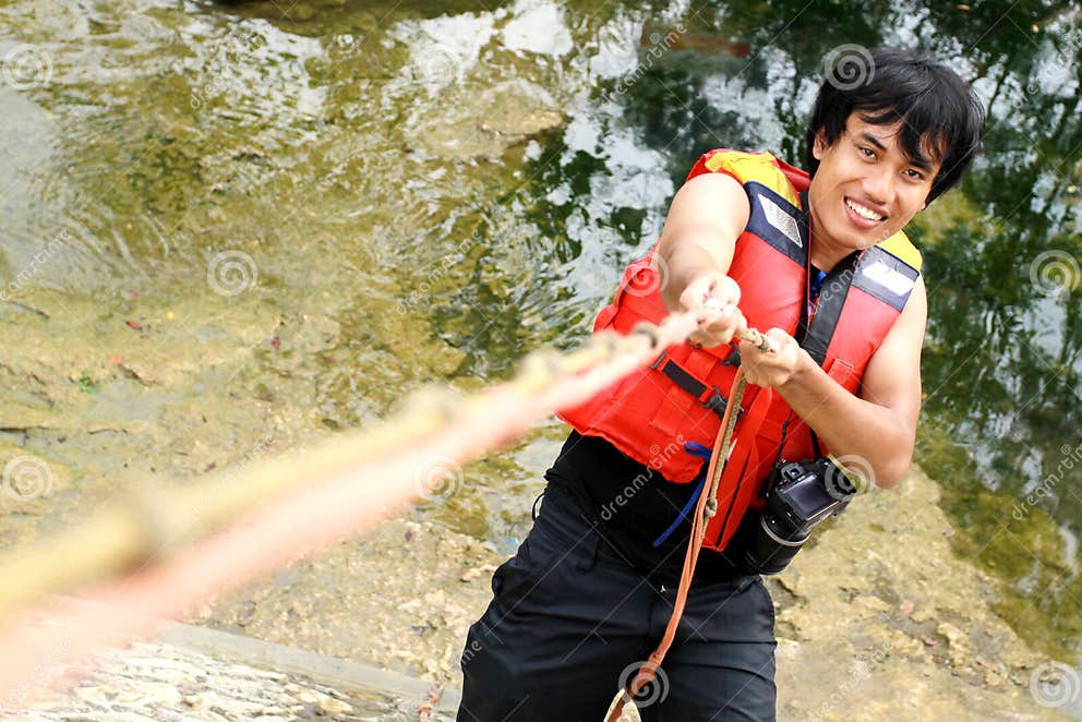 Man climbing using rope stock image. Image of dare, equipment - 25856401
