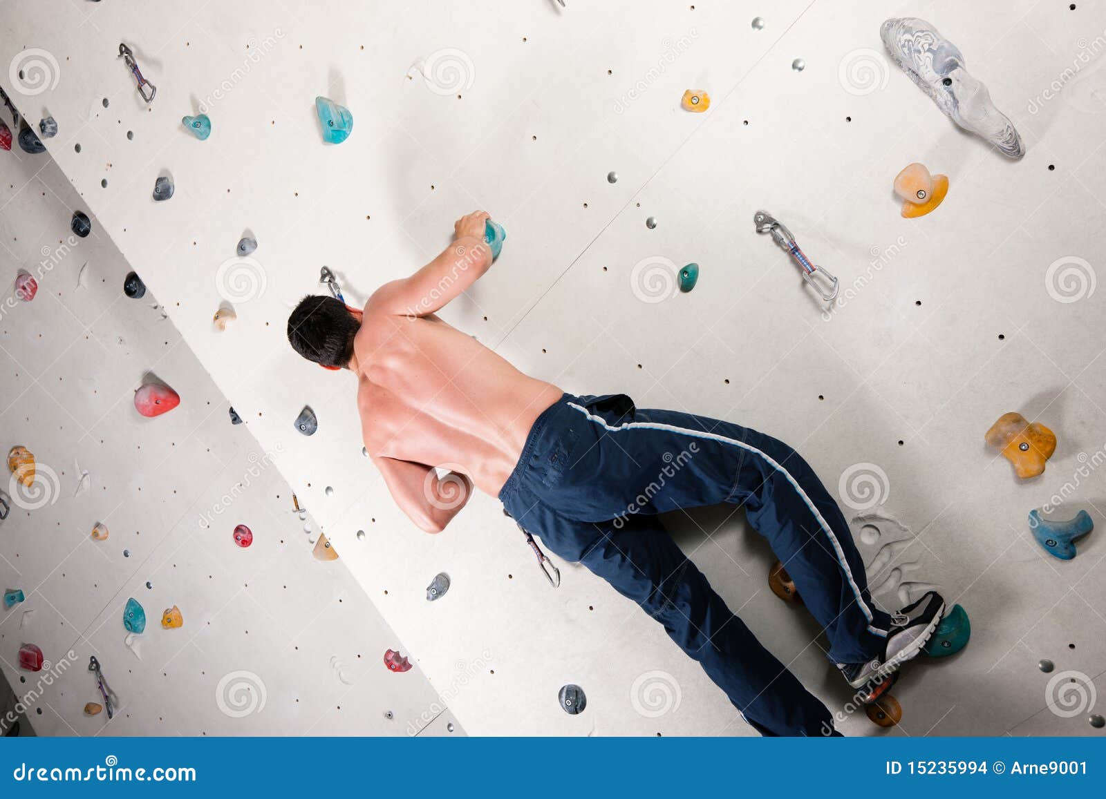 Man at the climbing wall stock photo. Image of fitness - 15235994
