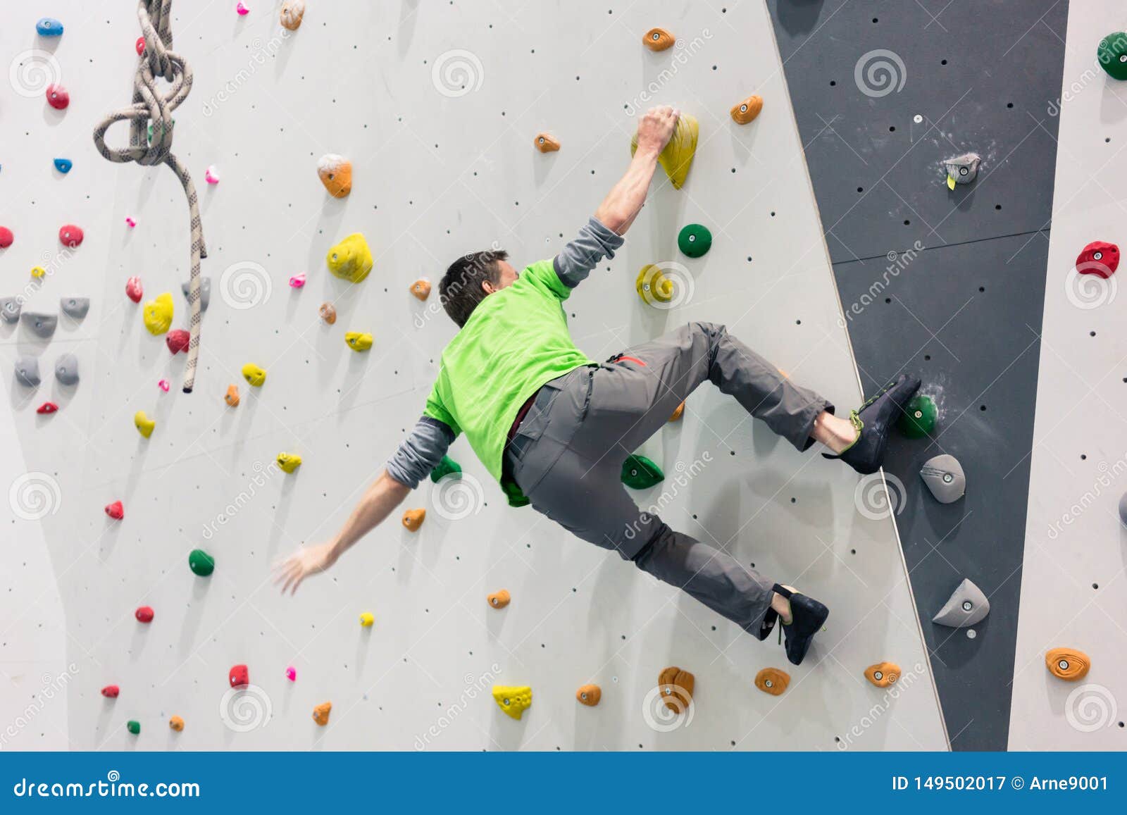 Man climbing on the wall stock image. Image of hanging - 149502017