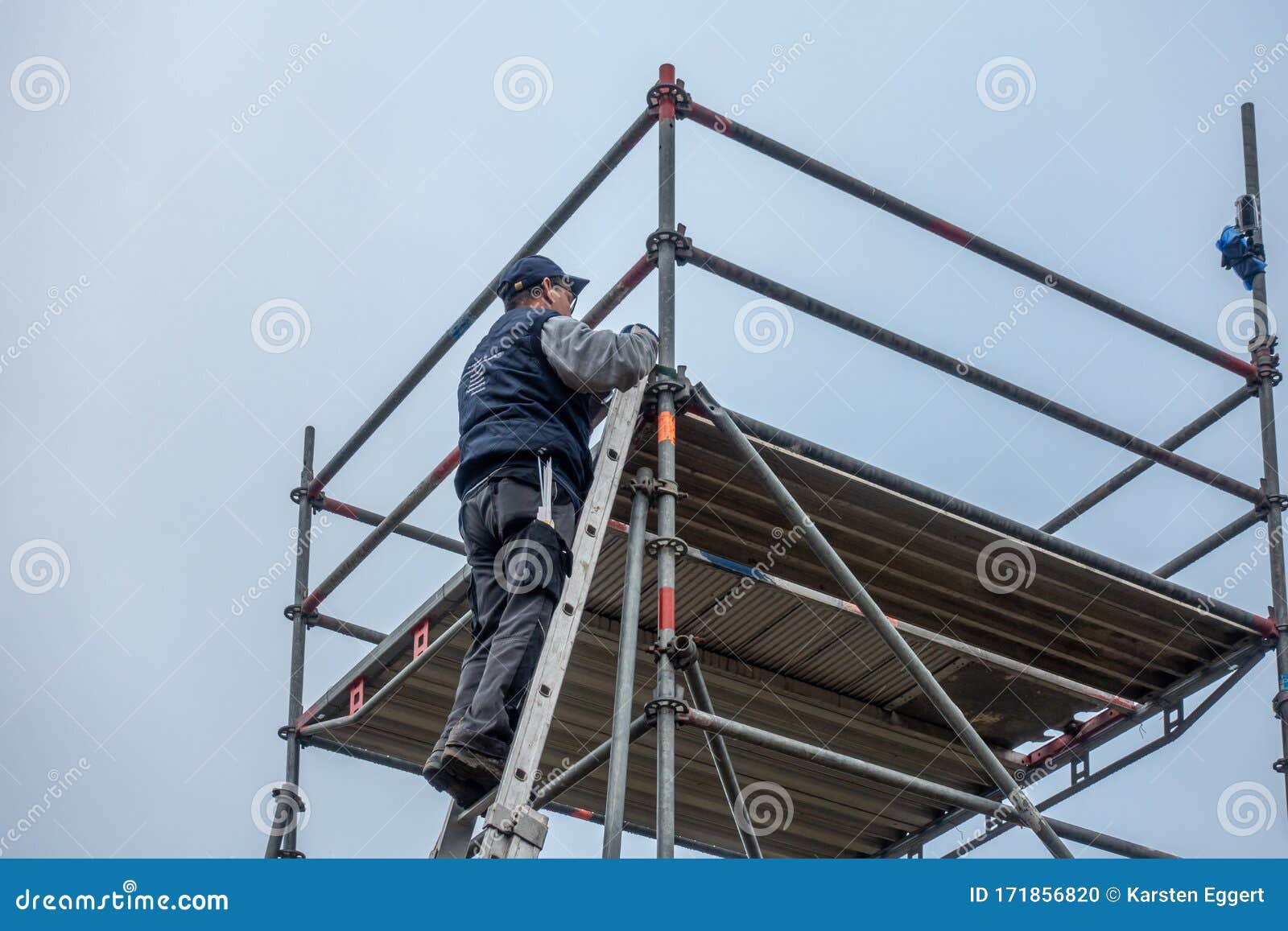 Man Climbs Onto Scaffolding on an Extension Ladder Editorial Image ...