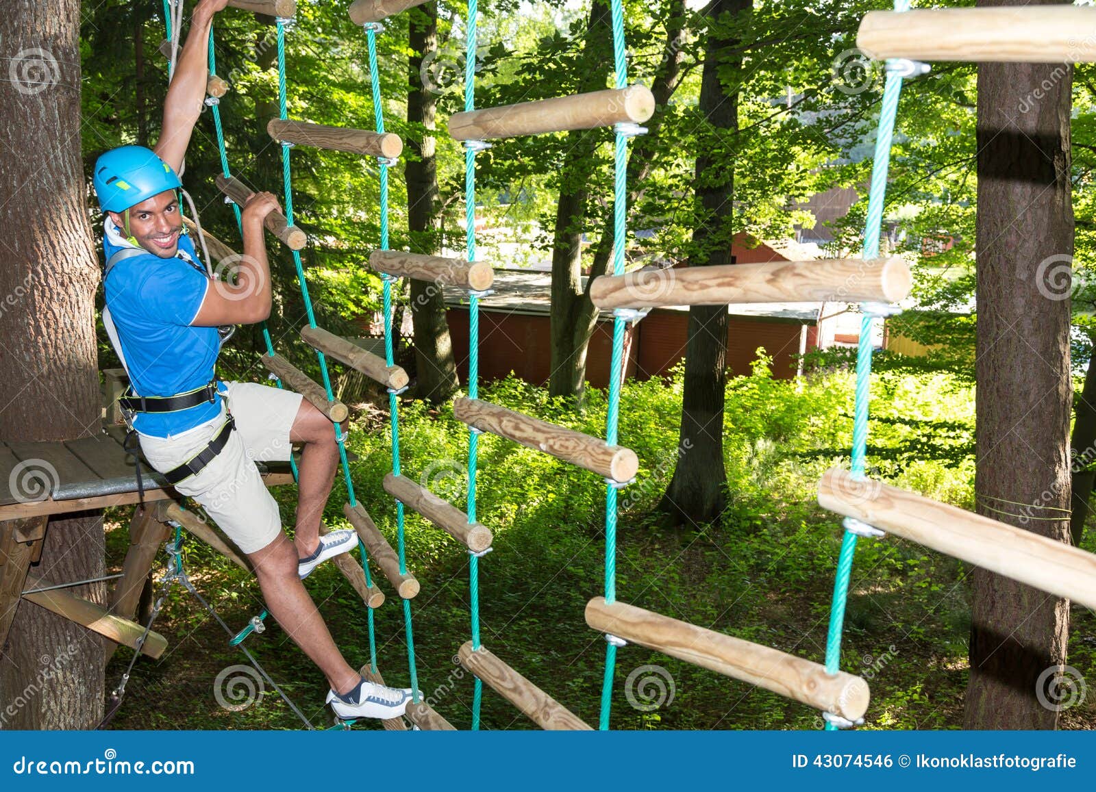 Man Climbs Over Obstacles at High Rope Court Stock Photo - Image of ...