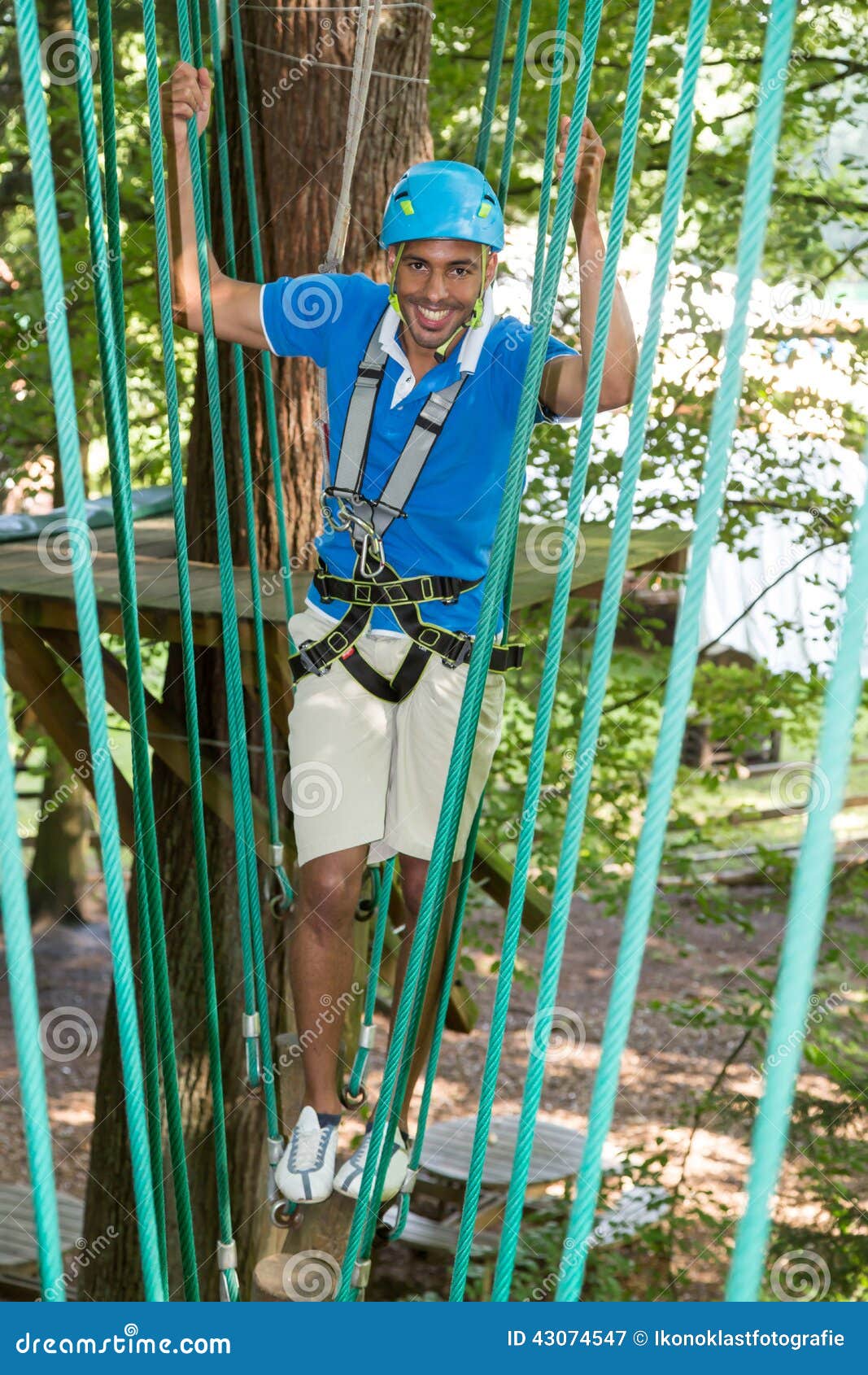 Man Climbs Over Obstacles at High Rope Court Stock Image - Image of ...