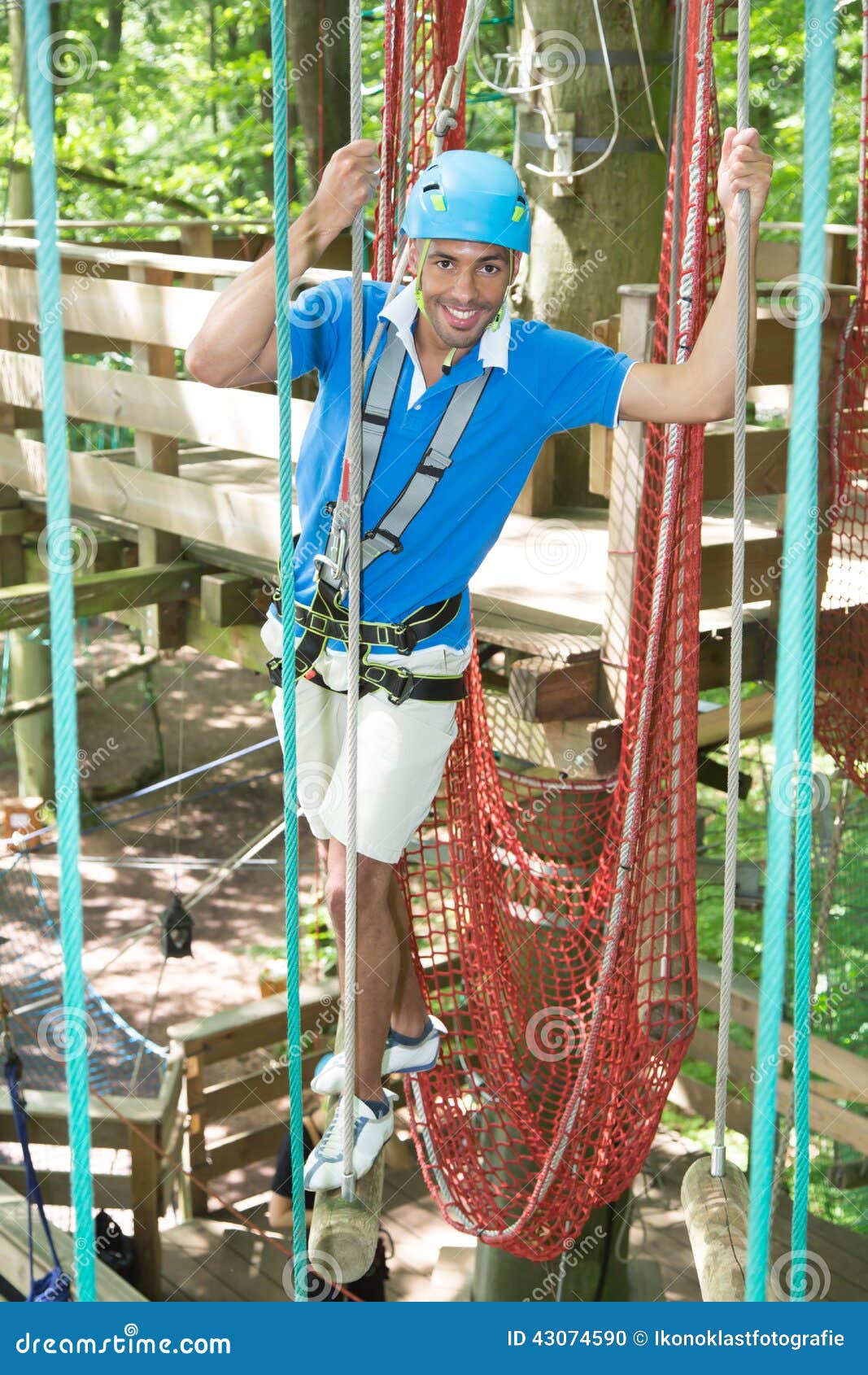 Man Climbs Over Obstacles at High Rope Court Stock Photo - Image of ...