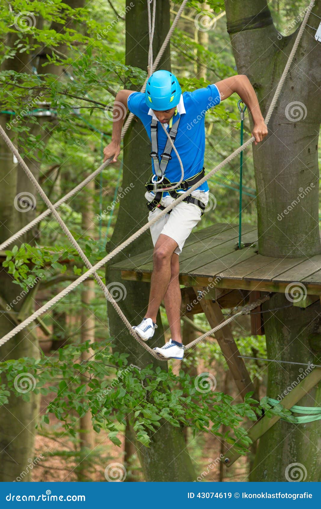 Man Climbs Over Obstacles at High Rope Court Stock Image - Image of ...