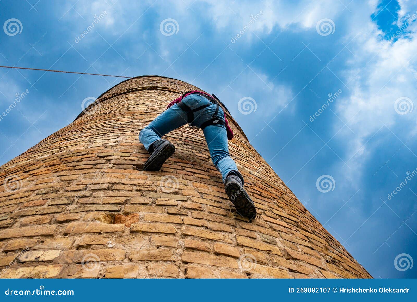 A Man Climbs Up a Tower with a Rope Stock Image - Image of hanging ...