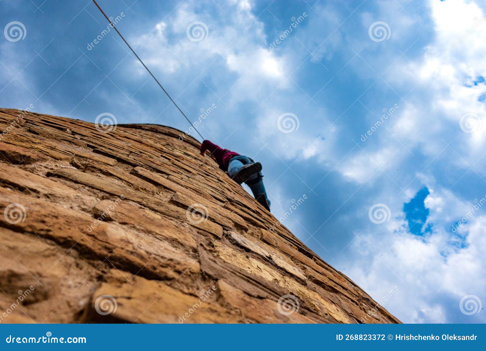A Man Climbs Up a Tower with a Rope Stock Photo - Image of climbing ...
