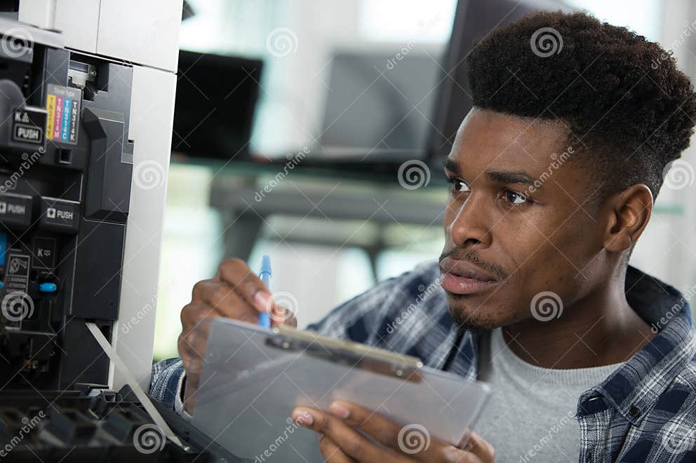 Man with Clipboard Servicing Printer Stock Image - Image of printer ...