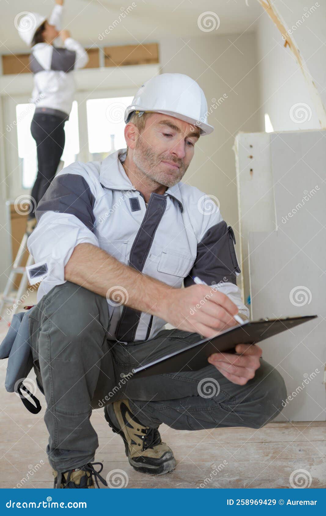 Man with Clipboard on Worksite Stock Image - Image of site, uniform ...