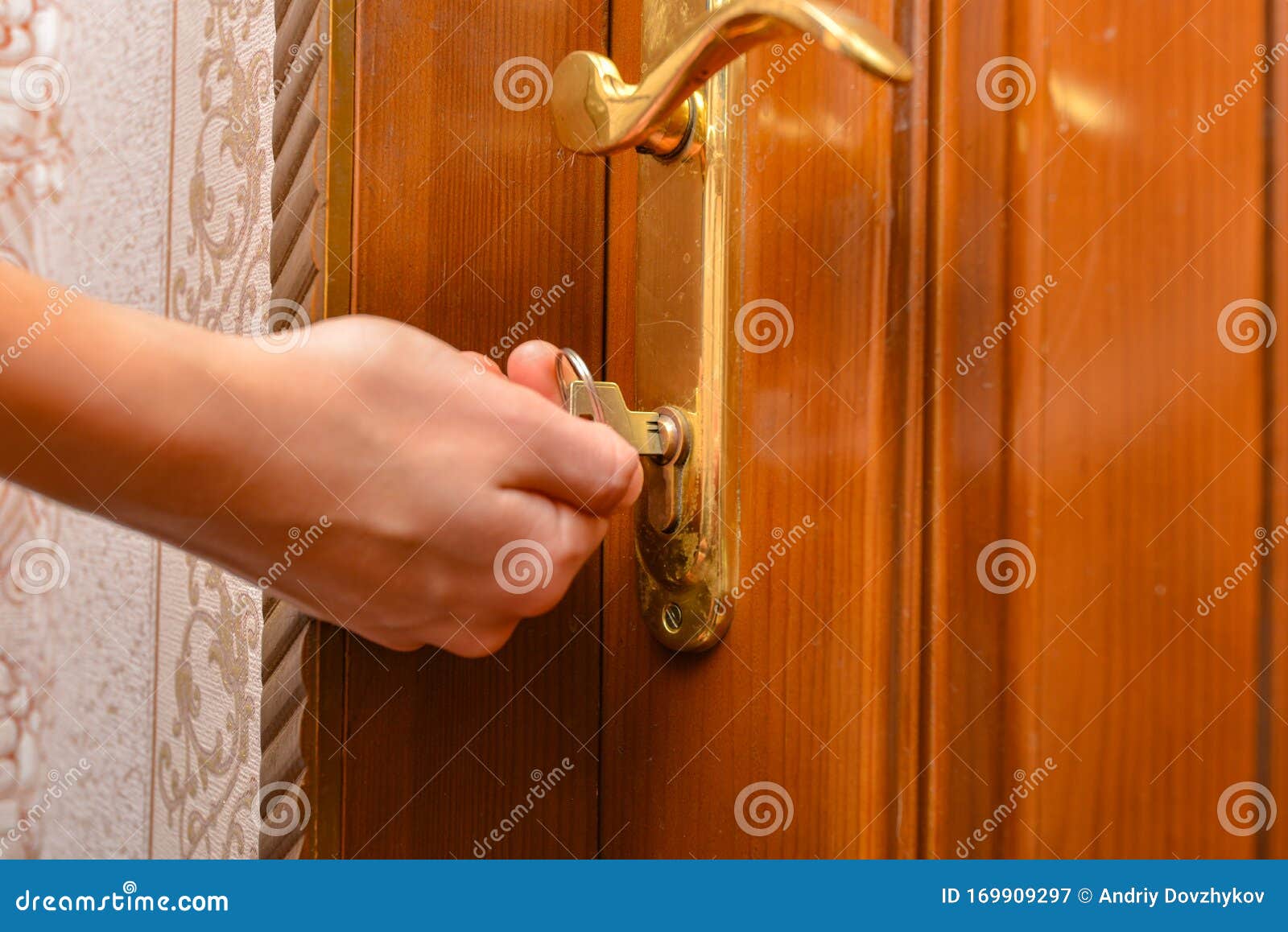 The Man Closes the Door Lock in the Apartment Stock Image - Image of ...