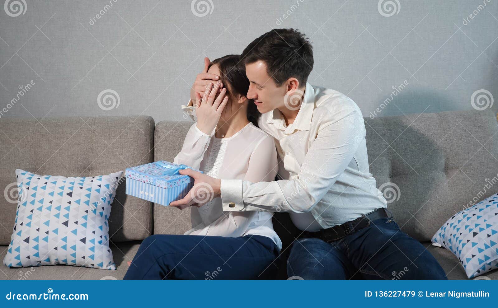 Man Closes His Is Girlfriend`s Eyes To Make Surprise Stock Image