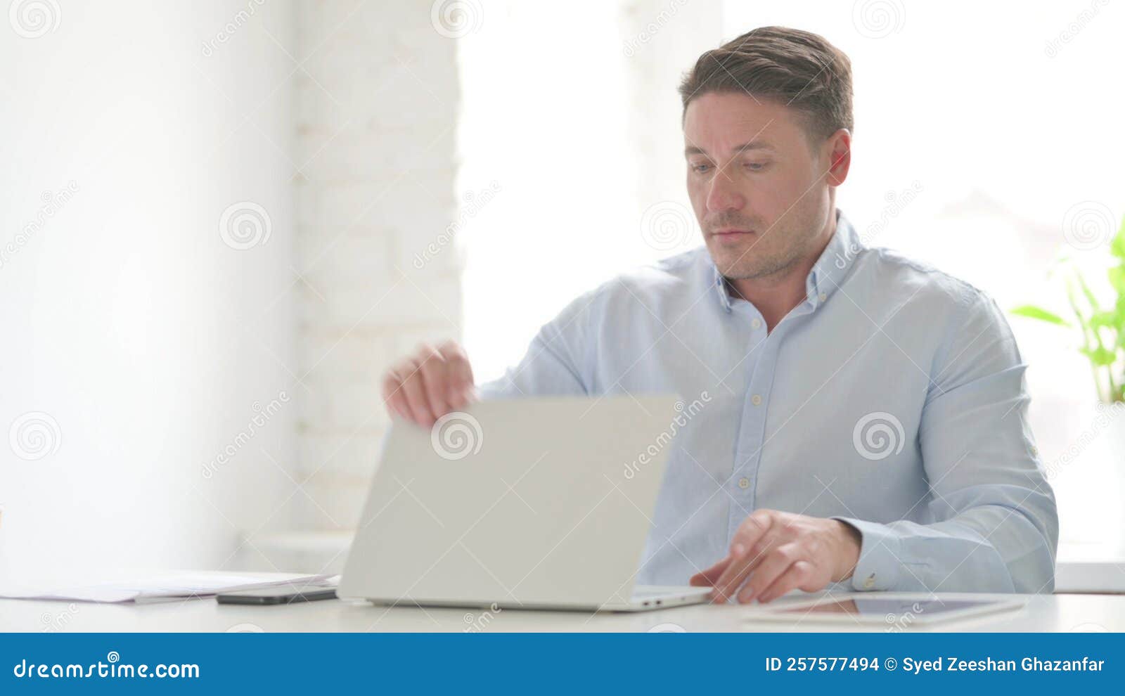 Man Closing Laptop Standing Up after Work Stock Photo - Image of ...