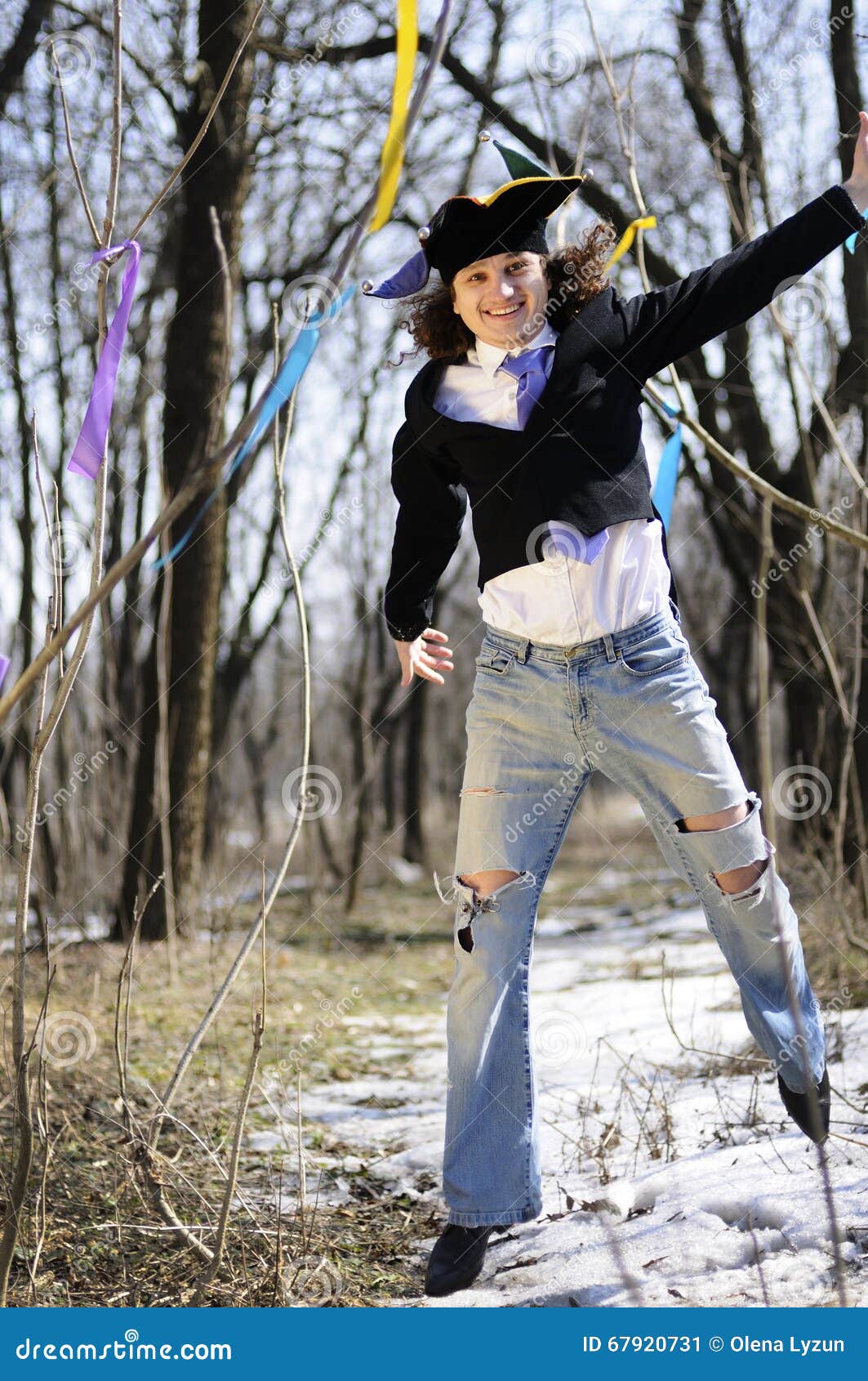 Man in clown hat jumping stock image. Image of absurd - 67920731