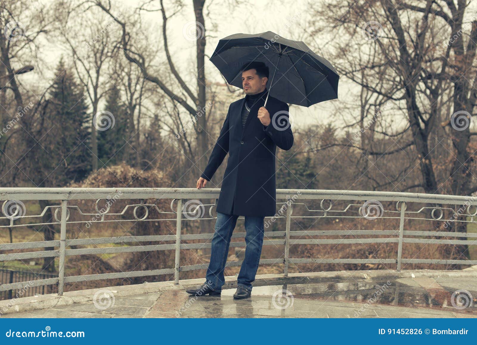 A Man in a Coat Walks in the Spring Park Stock Photo - Image of coat ...