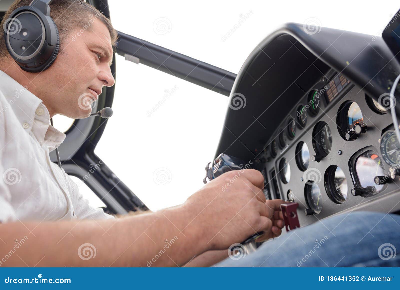 Man in cockpit aircraft stock photo. Image of headset - 186441352