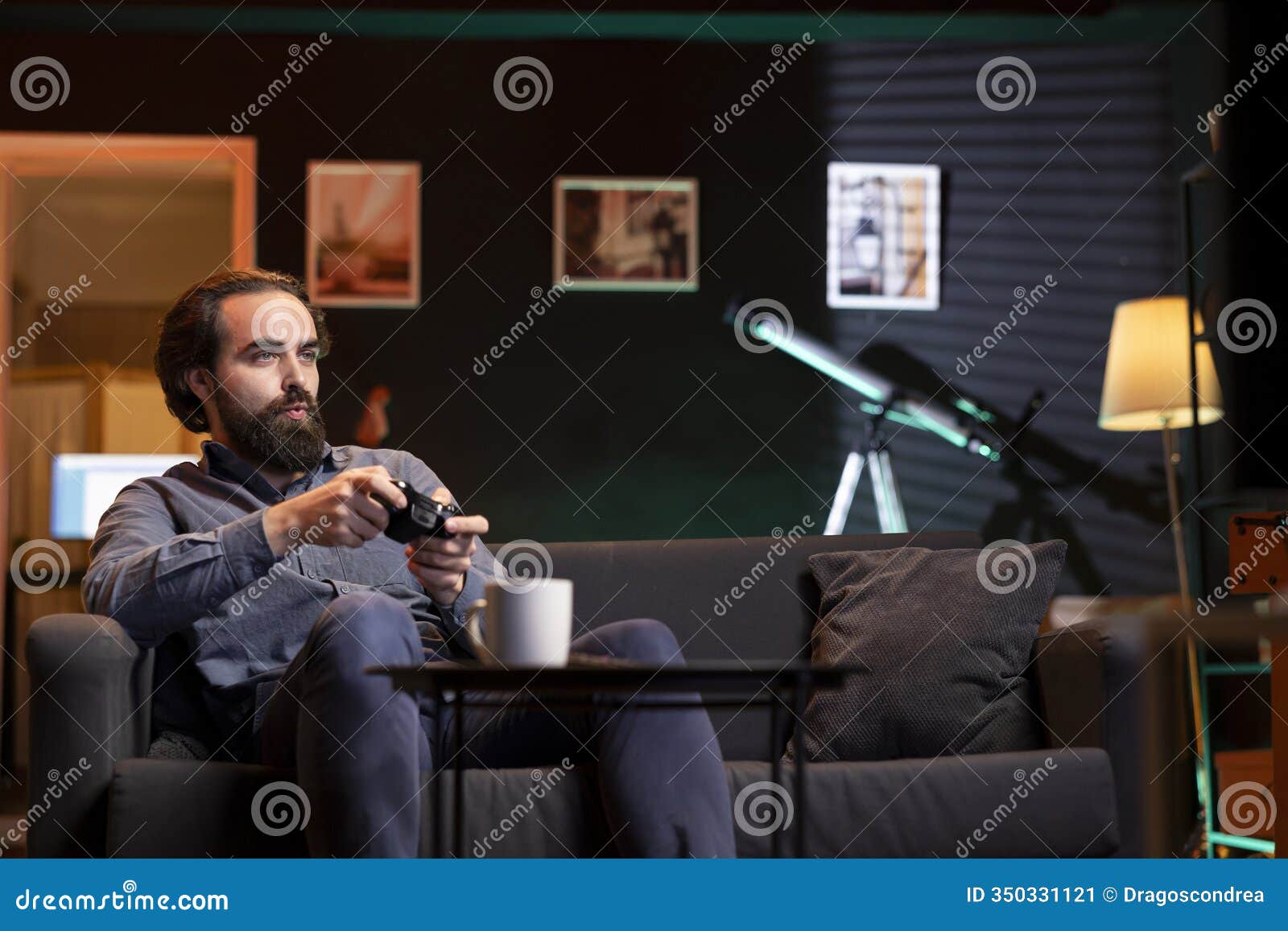 Man with Coffee in Front Using Controller To Finish Game before Going ...