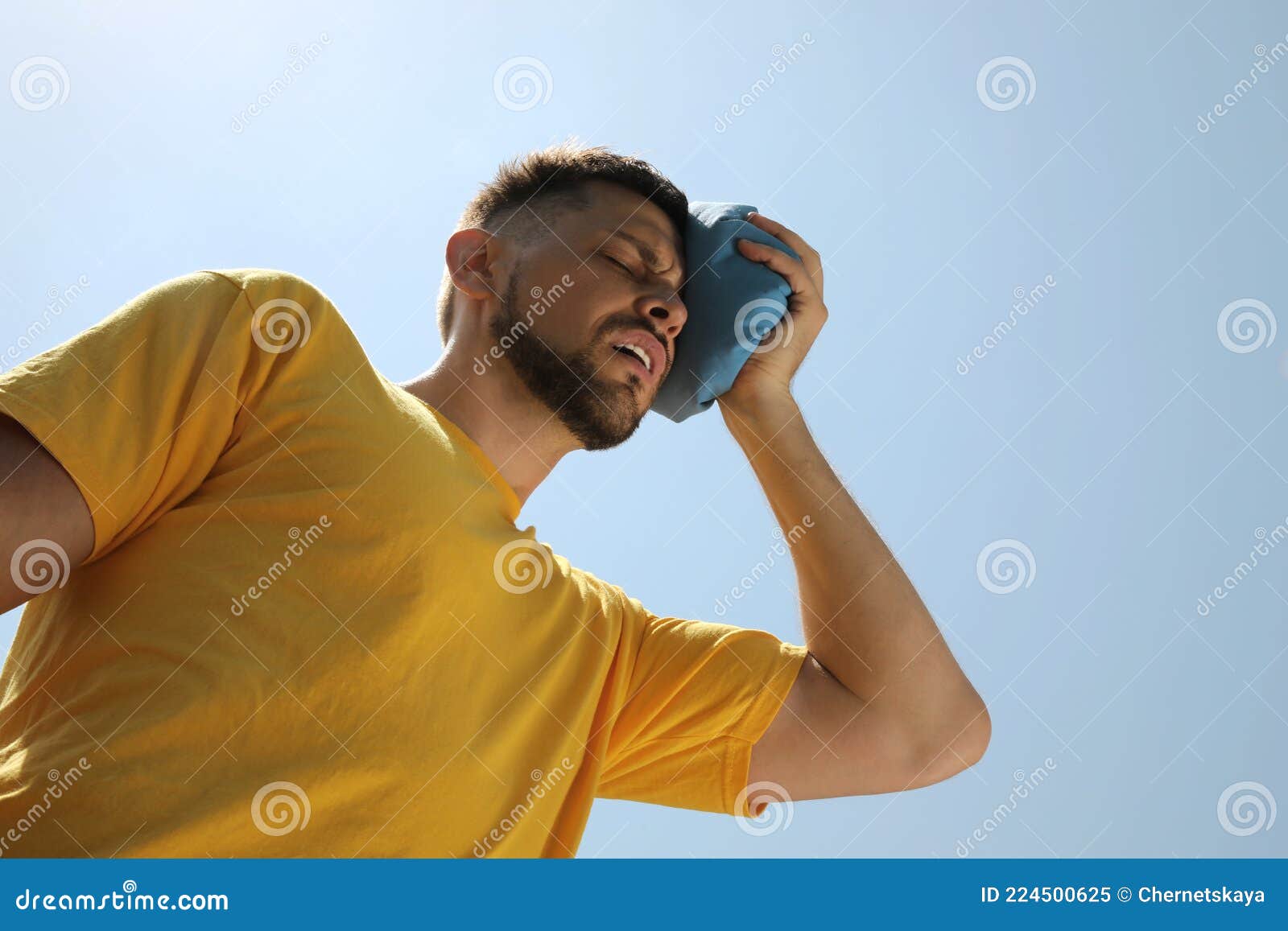 Man with Cold Pack Suffering from Heat Stroke Outdoors Stock Image ...
