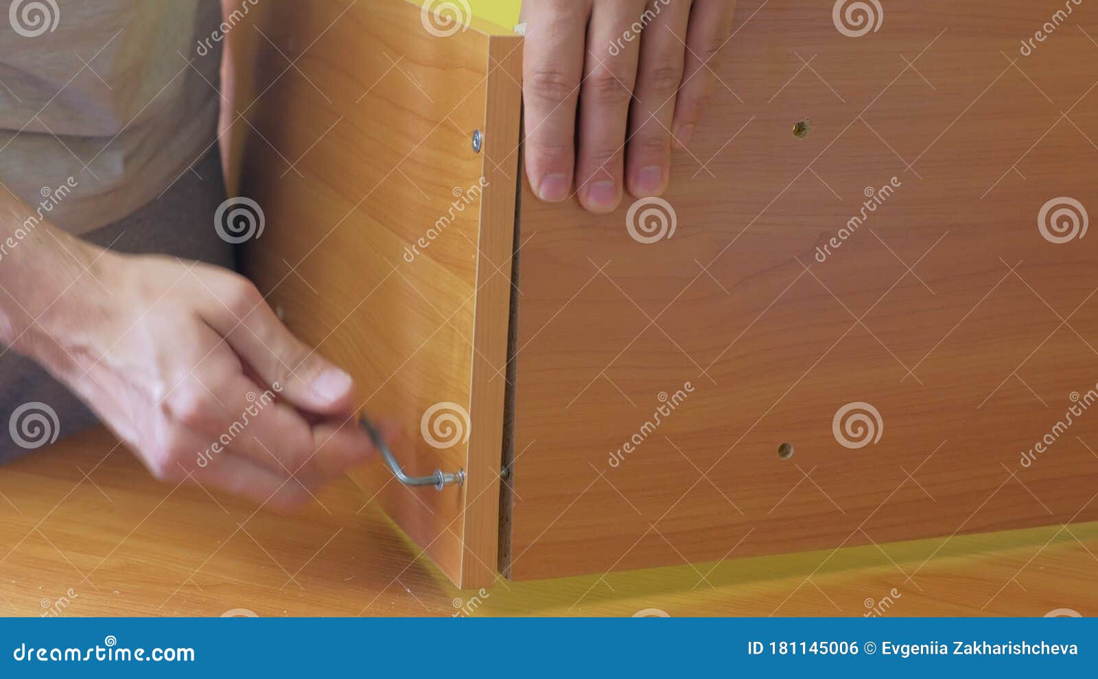 Man Is Collecting Parts Of Computer Table Screwing Shelf Screwdriver Closeup Stock Footage